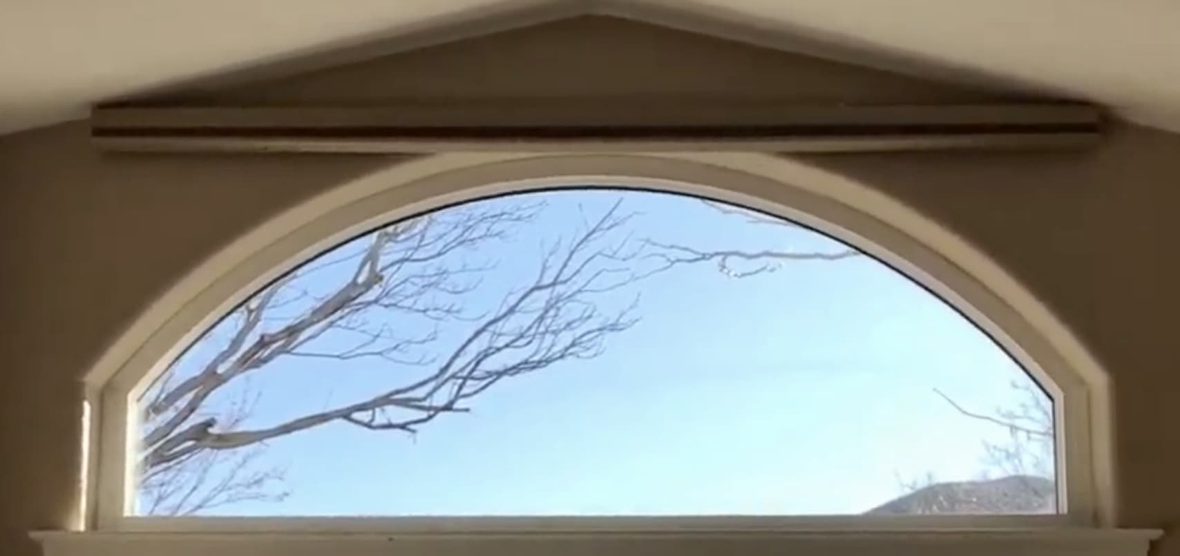 A Great Option For an Arch Top Window Treatment